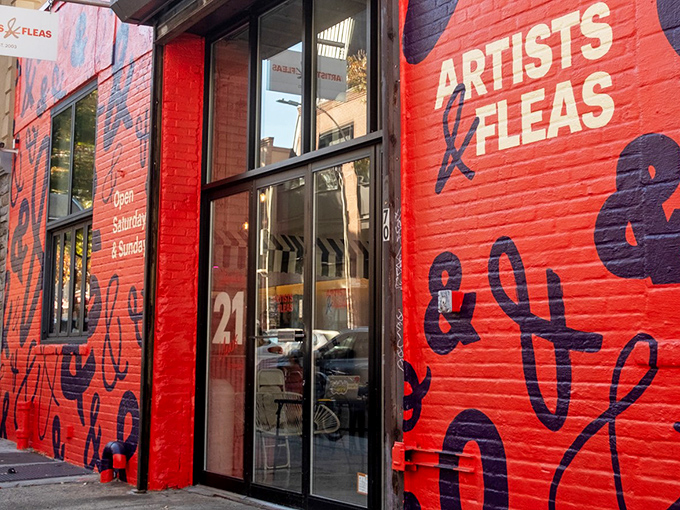 The vibrant red exterior of Artists & Fleas is like a siren call to treasure hunters &ndash; Brooklyn's creative pulse made visible in brick and paint.
