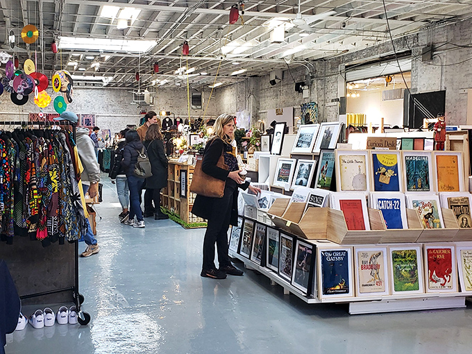 The industrial-chic interior of Artists & Fleas houses a treasure trove of creativity where shoppers browse everything from vintage prints to handcrafted jewelry.
