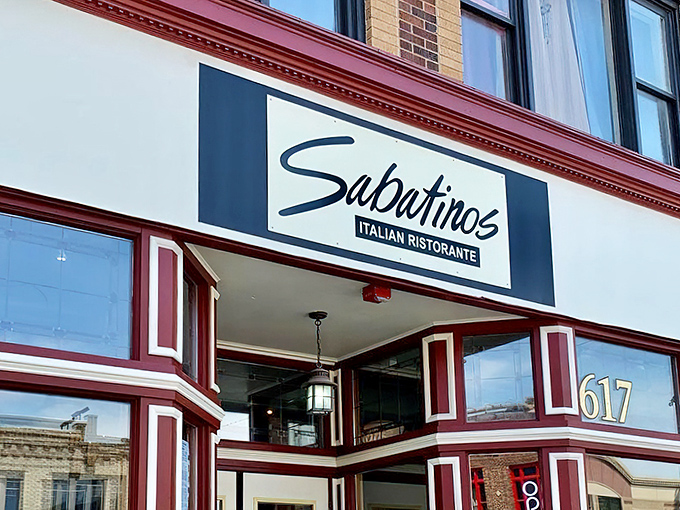 The classic red-trimmed storefront of Sabatino's beckons like an old friend, promising Italian comfort in the heart of downtown Rapid City.