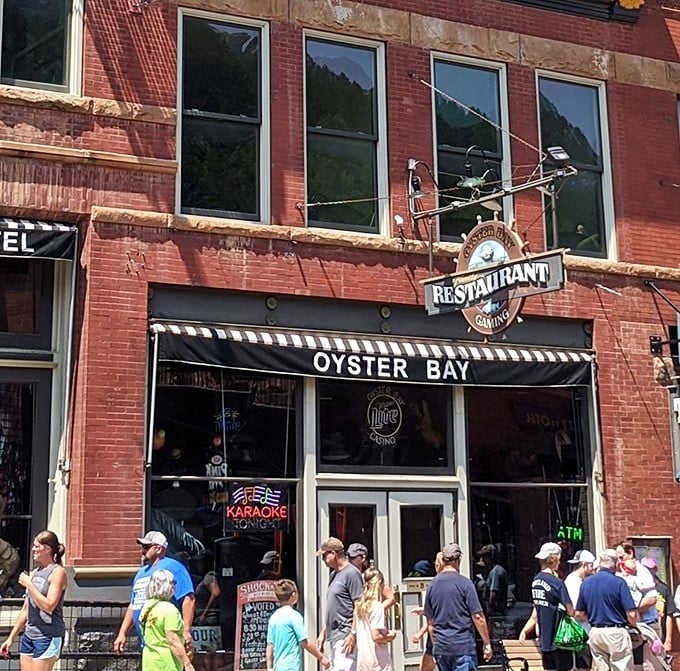 Nestled among Deadwood's historic brick facades, Oyster Bay beckons with its classic storefront and promise of unexpected culinary treasures.