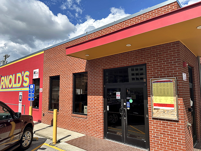 Arnold's brick exterior stands like a culinary lighthouse against Nashville's modern skyline, promising comfort food salvation to hungry souls.