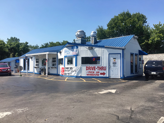 The iconic white and blue exterior of Karin's Kustard, complete with those distinctive mixer-shaped vents that promise frozen delights inside.