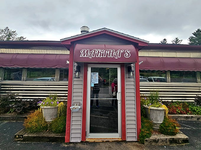 Martha's classic diner exterior beckons with its burgundy awnings and flower pots, promising comfort food and conversation in equal measure.