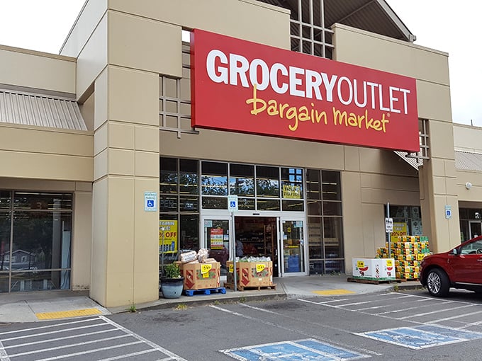 The iconic red Grocery Outlet sign promises treasure hunting for your taste buds without the expedition costs. Bargain paradise awaits behind those unassuming doors.