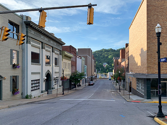 Brick facades tell stories without saying a word on Bluefield's historic main street, where American flags wave proudly against the mountain town's architectural timeline.