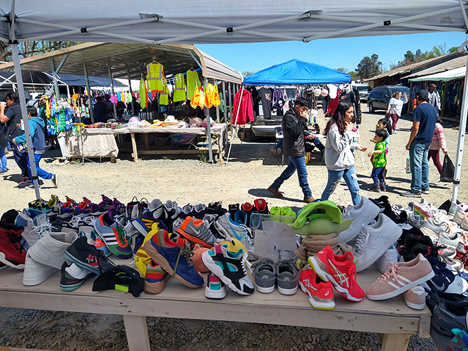 Sneaker heaven awaits! Tables overflowing with colorful footwear where bargain hunters find their next favorite pair.