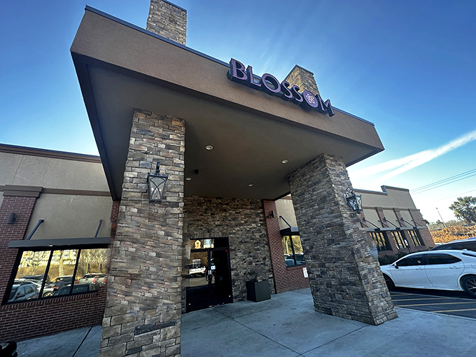 The stone facade of Blossom Buffet stands like a temple to abundance, promising culinary adventures that'll stretch both your palate and waistband.