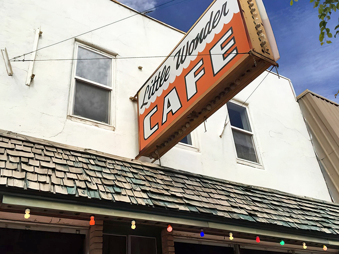 String lights add a touch of whimsy to this classic brick facade, where affordable meals and friendly faces await.