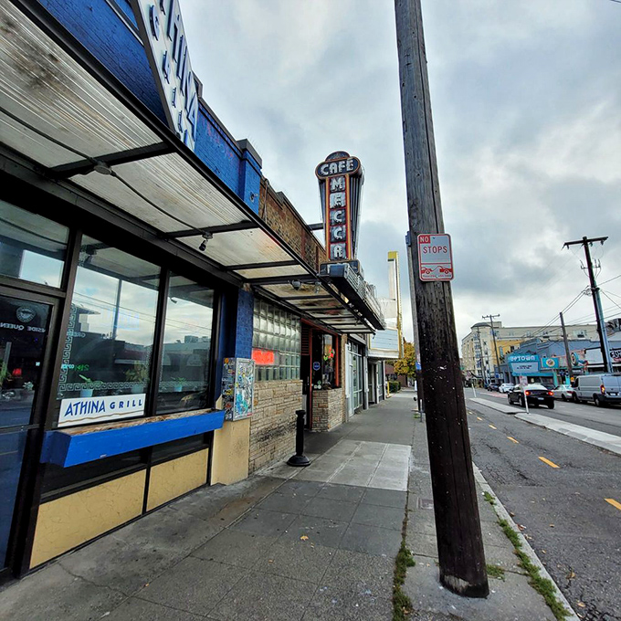 The Mecca Cafe's iconic neon sign stands like a beacon of hope for hungry souls and empty wallets in Seattle's Queen Anne neighborhood.