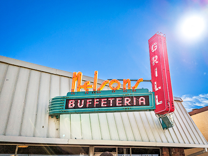 The neon glow of Nelson's sign against a blue Oklahoma sky &ndash; a beacon of hope for hungry travelers and a promise of comfort food ahead.