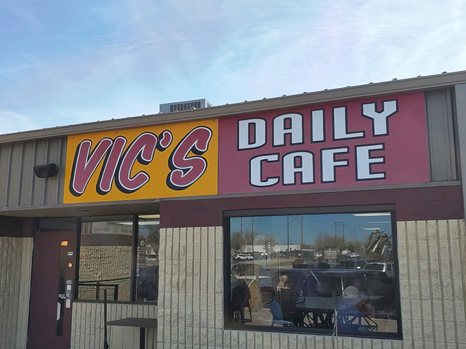 The unmistakable yellow and red sign of Vic's Daily Cafe stands as a beacon of breakfast hope in Albuquerque's morning landscape.