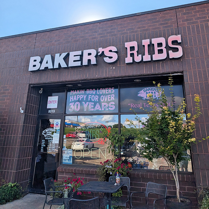 The brick exterior might be modest, but that "OPEN" sign glows like a beacon of hope for barbecue enthusiasts across the Twin Cities.