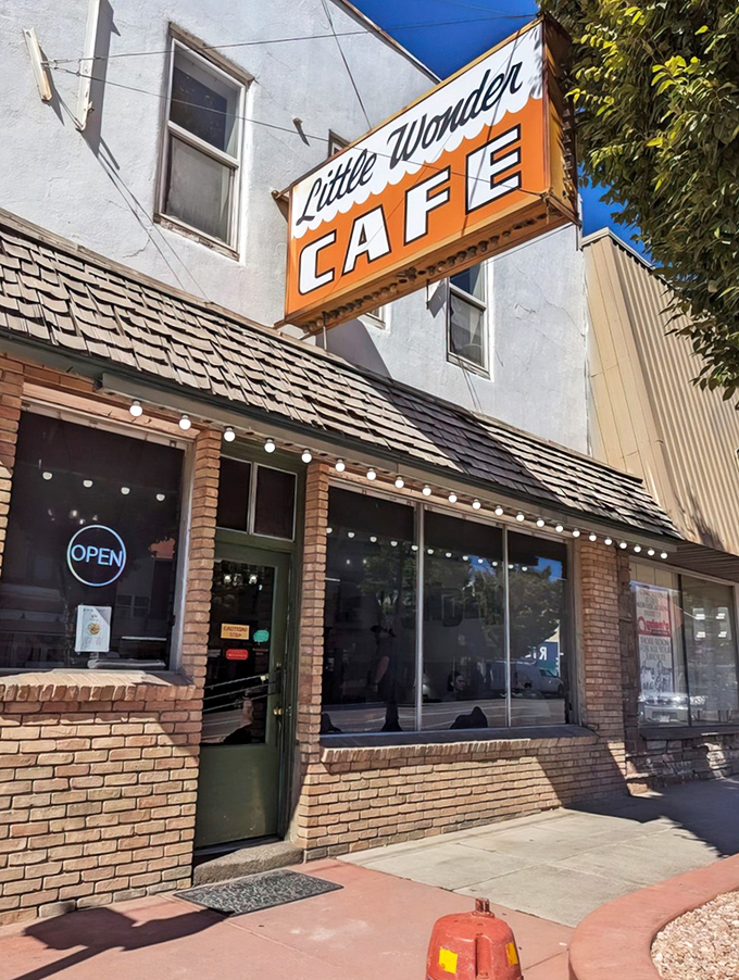 The vintage Little Wonder Cafe sign stands out against Utah's blue sky, a beacon of small-town dining excellence.