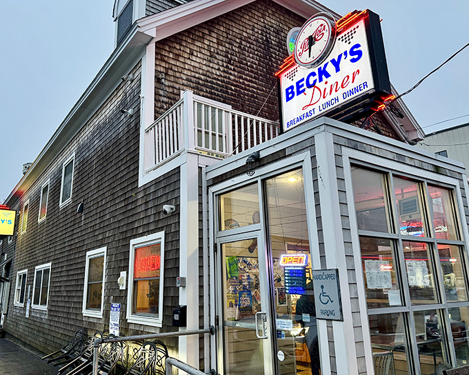 The weathered shingles and iconic neon sign of Becky's Diner welcome hungry souls to Portland's working waterfront.
