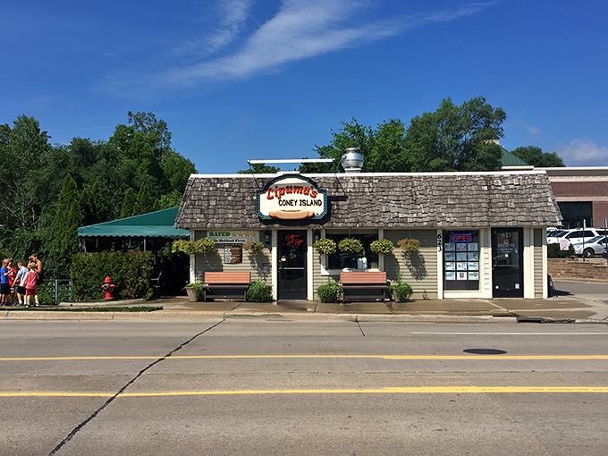 Downtown Rochester's skyline provides the perfect backdrop for this humble hot dog haven, where culinary magic happens daily.