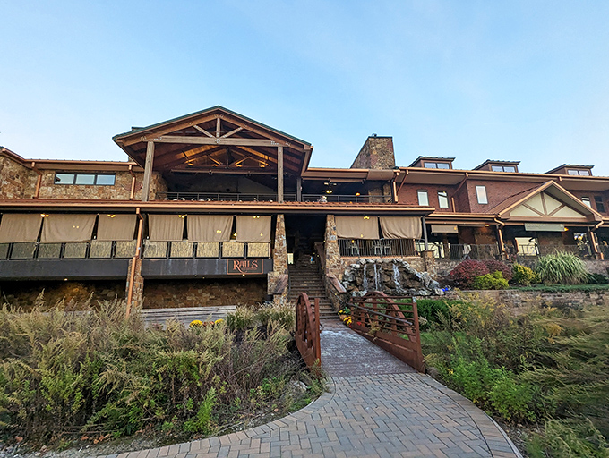 A winding path leads to culinary nirvana, where rustic stonework and wooden beams create the perfect backdrop for meat-induced euphoria.