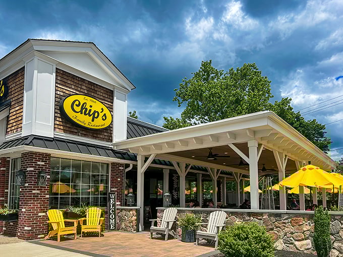 The iconic yellow sign of Chip's beckons like a breakfast lighthouse against Connecticut skies. Those Adirondack chairs aren't just for show&mdash;they're for the pancake recovery period.