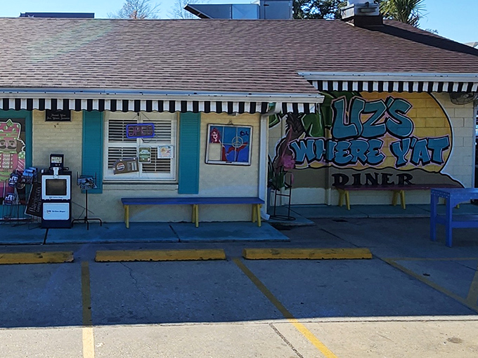 A neon "OPEN" sign glows against turquoise shutters, like a beacon calling all breakfast enthusiasts to their morning salvation.