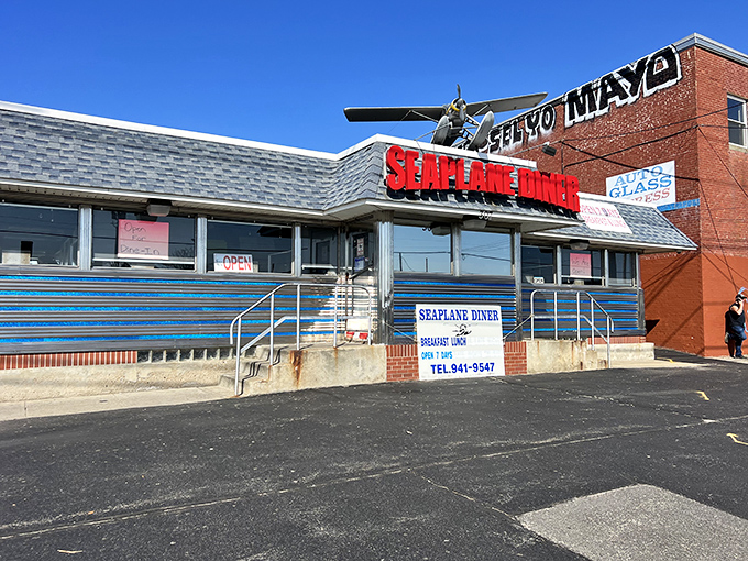 The iconic Seaplane Diner sign welcomes hungry travelers with its vintage airplane perched above&mdash;a beacon of breakfast hope on Providence's Allens Avenue.