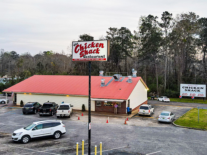 The unassuming exterior of The Chicken Shack proves once again that culinary treasures often hide behind the simplest facades. That red roof has sheltered chicken dreams since 1968.