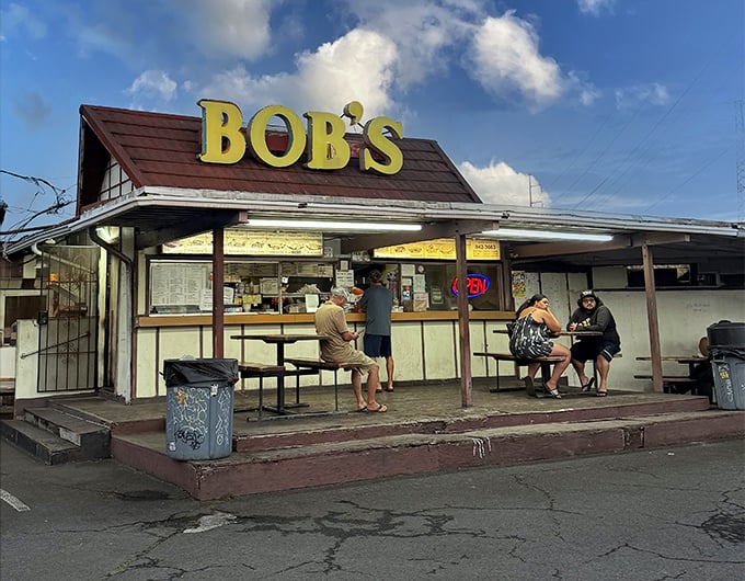 The iconic yellow "BOB'S" sign has been a beacon for hungry locals since the disco era. No fancy architecture needed when the food speaks this loudly.