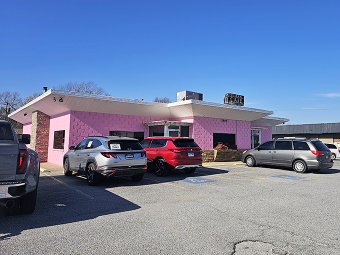The unmistakable pink exterior of Neal's Cafe stands out like a flamingo in a business suit convention. Comfort food paradise awaits!