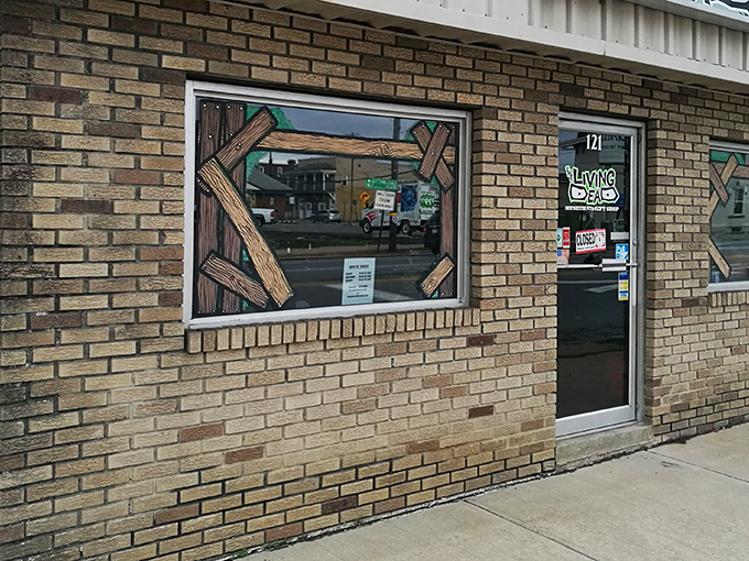 The unassuming brick exterior of The Living Dead Museum belies the macabre treasures within. Those wooden boards aren't keeping zombies out&mdash;they're inviting you in!
