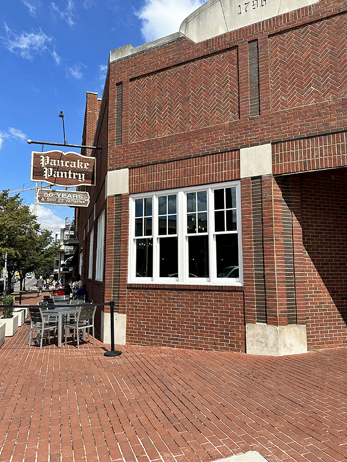 The brick facade of Pancake Pantry stands like a breakfast beacon in Hillsboro Village, promising pancake perfection to those patient enough to wait.