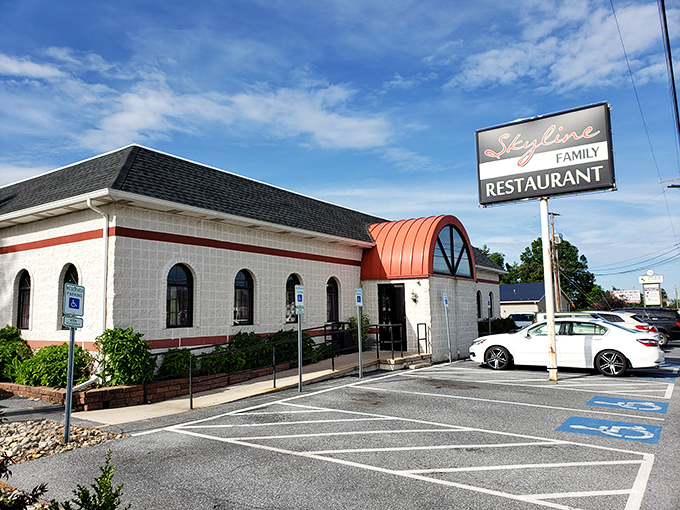 The classic white-and-red exterior with that distinctive copper awning says "come in, relax, and prepare for comfort food nirvana."