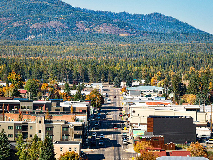 Fall paints Columbia Falls in golden hues, with mountains standing guard over this gateway to wilderness adventures.