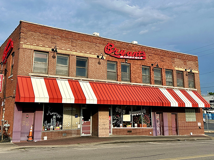 The iconic red sign against brick says everything you need to know: barbecue royalty lives here. No palace, just pure Kansas City tradition.