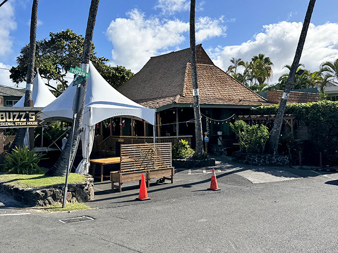 Buzz's iconic exterior welcomes you like an old friend, with mature trees providing natural shade for this beloved Kailua institution.