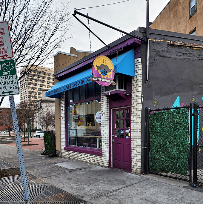 The purple door serves as a portal to another dimension &ndash; one where calories don't count and donuts wear mustaches with pride.