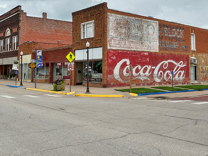 That vintage Coca-Cola sign isn't just advertising &ndash; it's a time portal to when conversations happened face-to-face instead of thumb-to-screen.