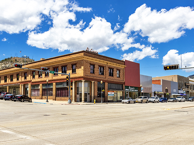 Historic brick buildings stand proudly under New Mexico's brilliant blue skies, embodying Raton's authentic small-town charm and architectural heritage.
