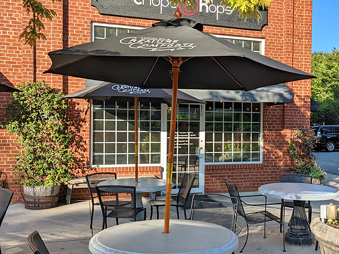 Outdoor dining at its most charming&mdash;where umbrella-shaded tables and flowering planters transform a simple meal into a small-town Georgia afternoon to remember.