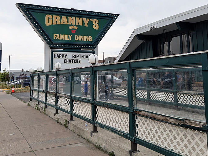 The iconic green triangular sign of Granny's welcomes hungry travelers like a beacon of breakfast hope in Cody's sea of chain restaurants.