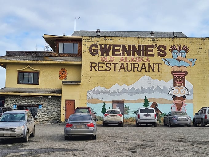 The unmistakable yellow beacon of Gwennie's Old Alaska Restaurant stands proud against the Anchorage sky, its mural promising mountain-sized portions and authentic Alaskan comfort inside.