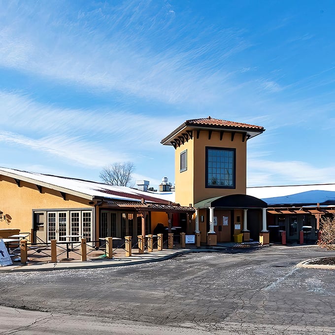 The Tuscan-inspired exterior of Mancy's Italian Grill stands like a Mediterranean mirage in Toledo, promising culinary adventures beyond its ochre walls.