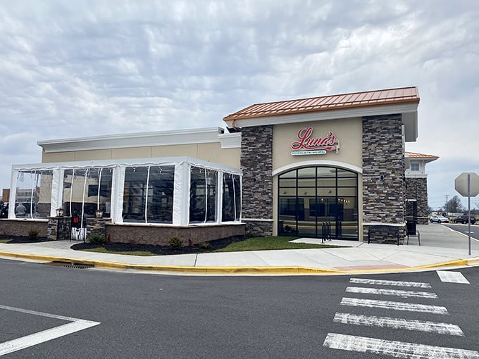 Luna's exterior stands as a modern-day beacon for pizza pilgrims, its stone facade and copper accents promising Italian treasures within.