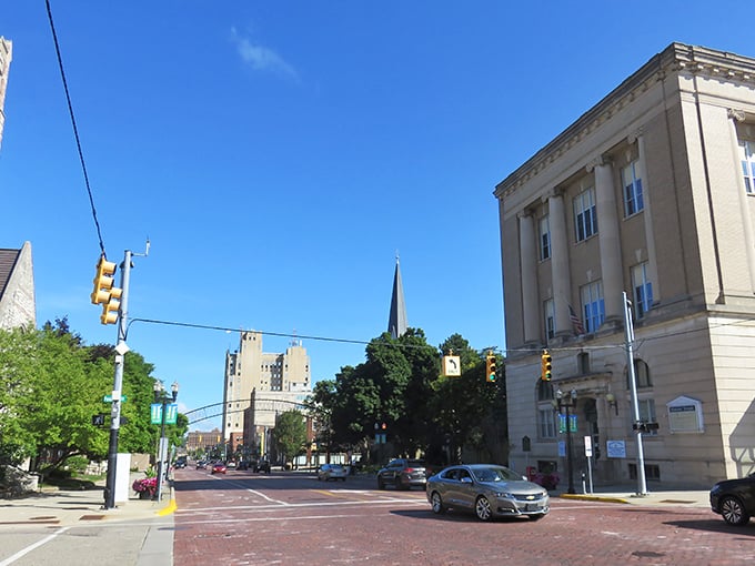 Downtown Flint's historic architecture stands proudly against blue skies, a testament to the city's resilient character and industrial heritage.