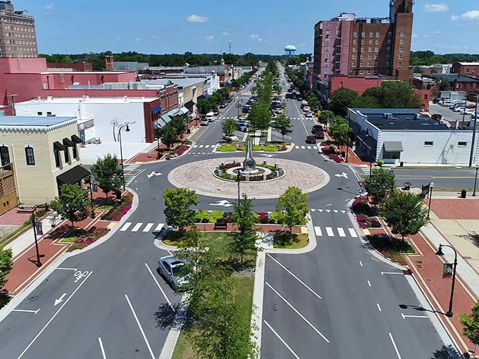 Downtown Goldsboro's revitalized center showcases a beautifully designed roundabout, where brick-lined streets and historic buildings create an inviting small-town atmosphere perfect for leisurely exploration.