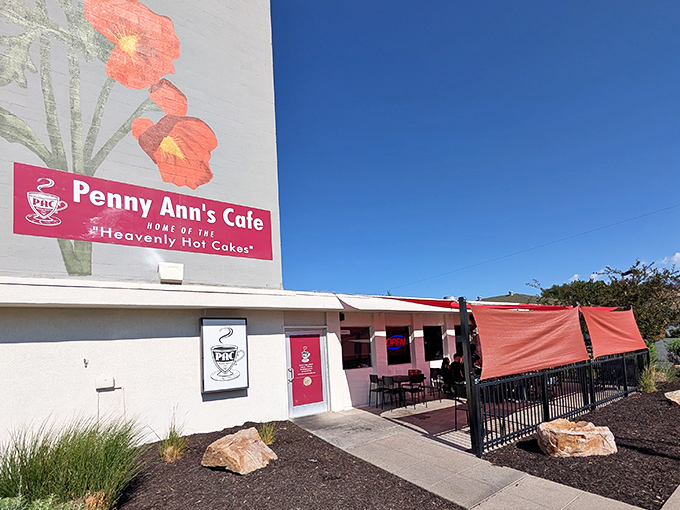 The iconic pink signage of Penny Ann's Cafe promises "Heavenly Hot Cakes" against a brilliant Utah sky&mdash;a breakfast beacon that never disappoints.