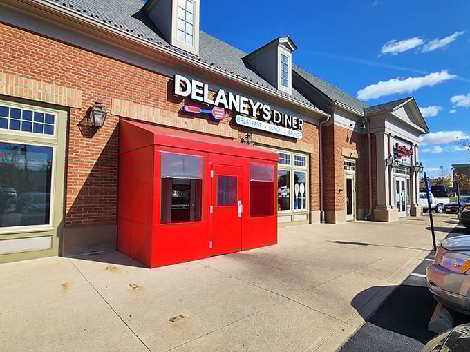 That iconic red entrance isn't just a door&mdash;it's a portal to comfort food nirvana. Delaney's brick exterior promises traditional diner delights with a dash of Columbus charm.