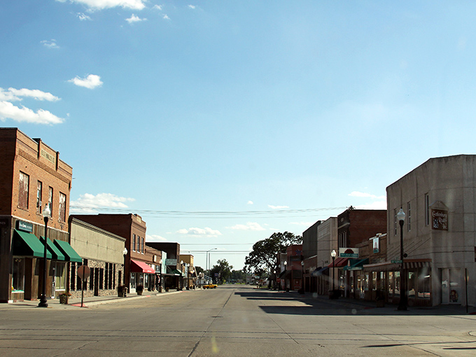 Main Street magic happens here, where brick storefronts and colorful awnings tell stories of community pride.
