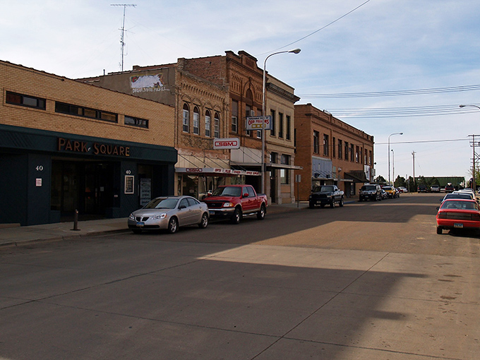Downtown Dickinson's historic brick buildings stand like sentinels of small-town charm, where you can actually find parking without developing a nervous condition.
