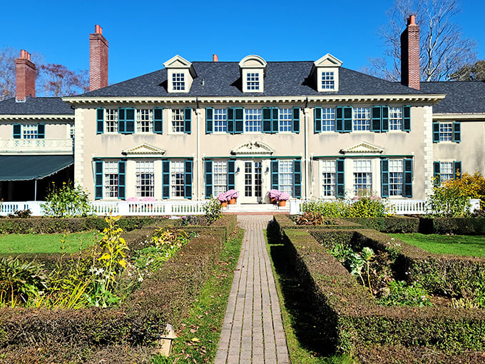 Hildene's stately façade welcomes visitors with Georgian elegance, where history and architecture dance together against Vermont's brilliant blue skies.