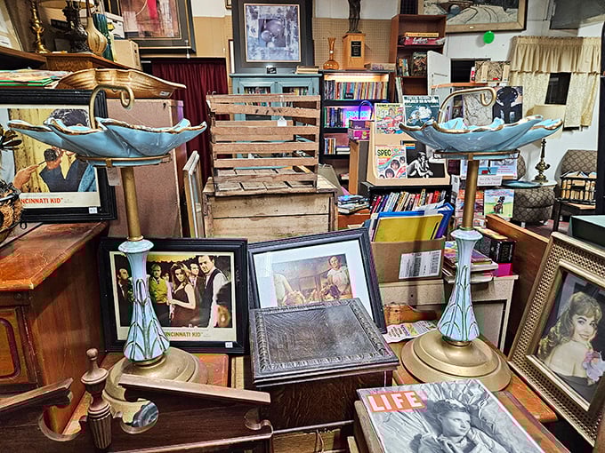 The distinctive red and white exterior of Nitro Antique Mall beckons treasure hunters with its eye-catching mural and stone accents&mdash;architectural character that hints at the wonders within.