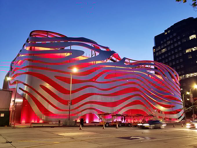 The Petersen's undulating red exterior ribbons make it look like the world's most stylish hot rod caught mid-zoom, a true architectural marvel on Wilshire Boulevard.