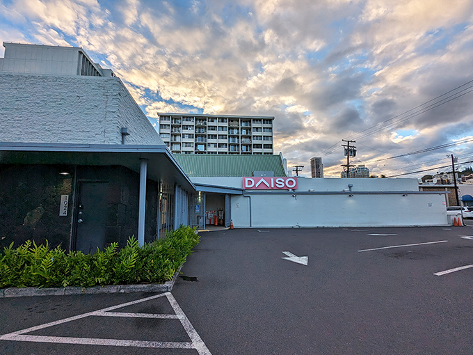 Sunshine breaks through clouds above Daiso's entrance, nature's spotlight on Hawaii's favorite affordable shopping destination.